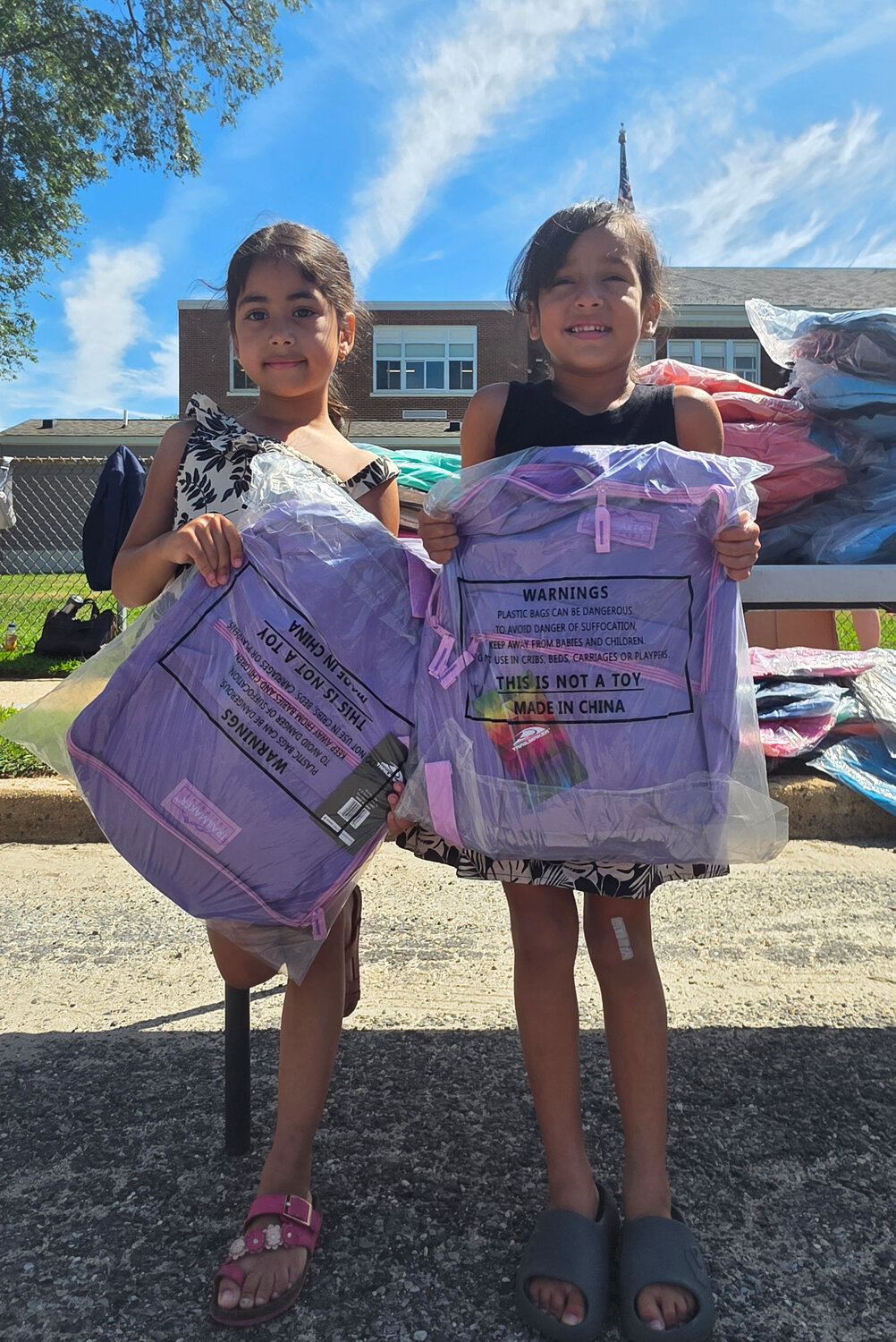 Delia DeRiggi-Whitton, Nassau PBA host backpack giveaway for Glen Cove ...