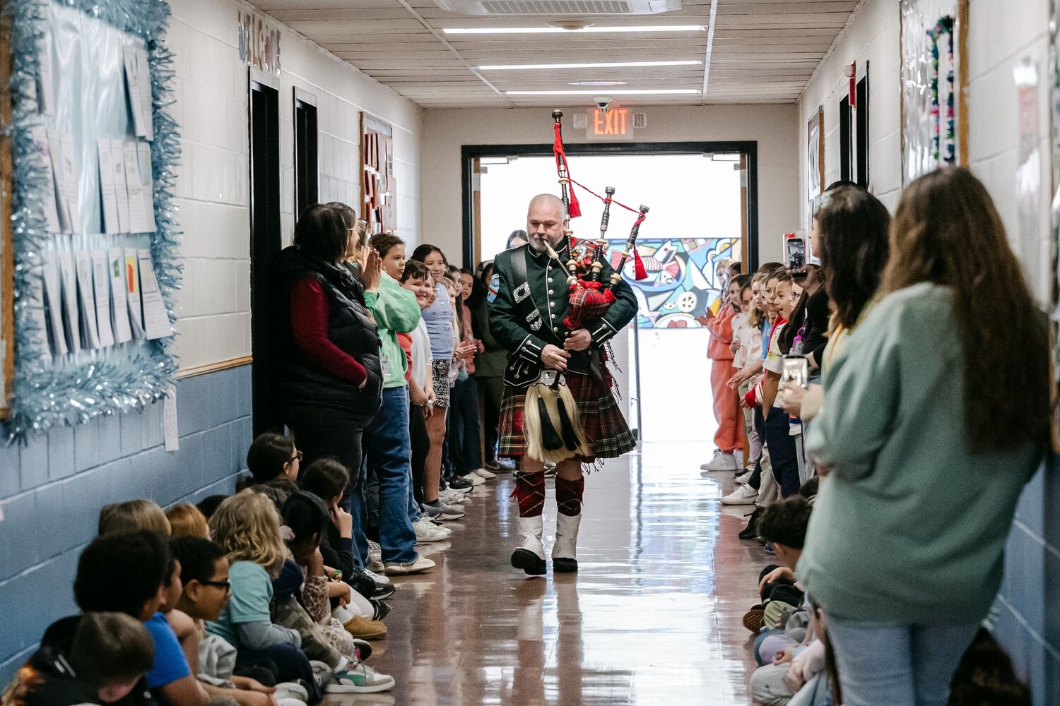 Rhame Avenue students celebrate St. Patrick’s Day with bagpipes ...
