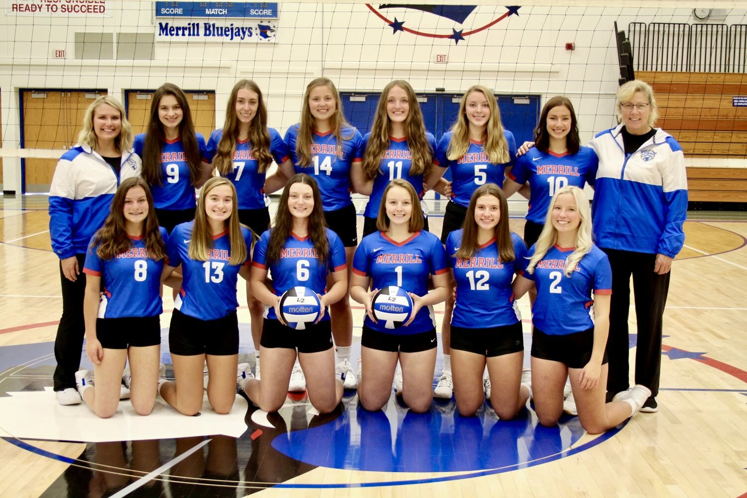 Spikers edged by Evergreens - Merrill Foto News