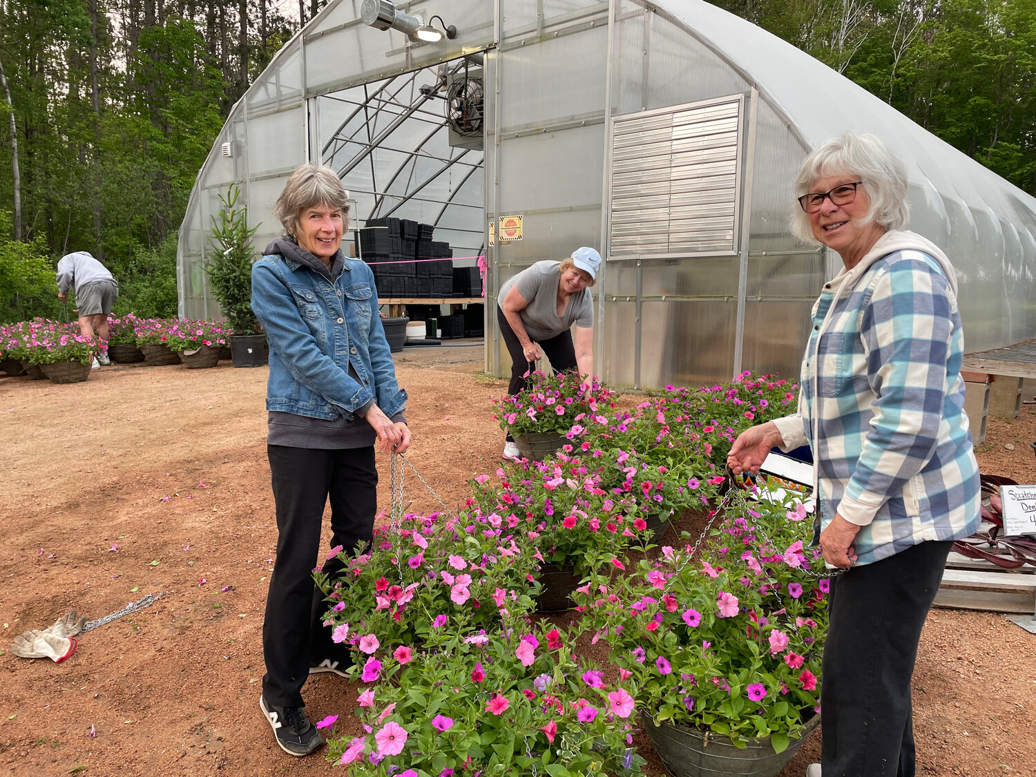 Volunteers keep Merrill blooming all summer long - Merrill Foto News