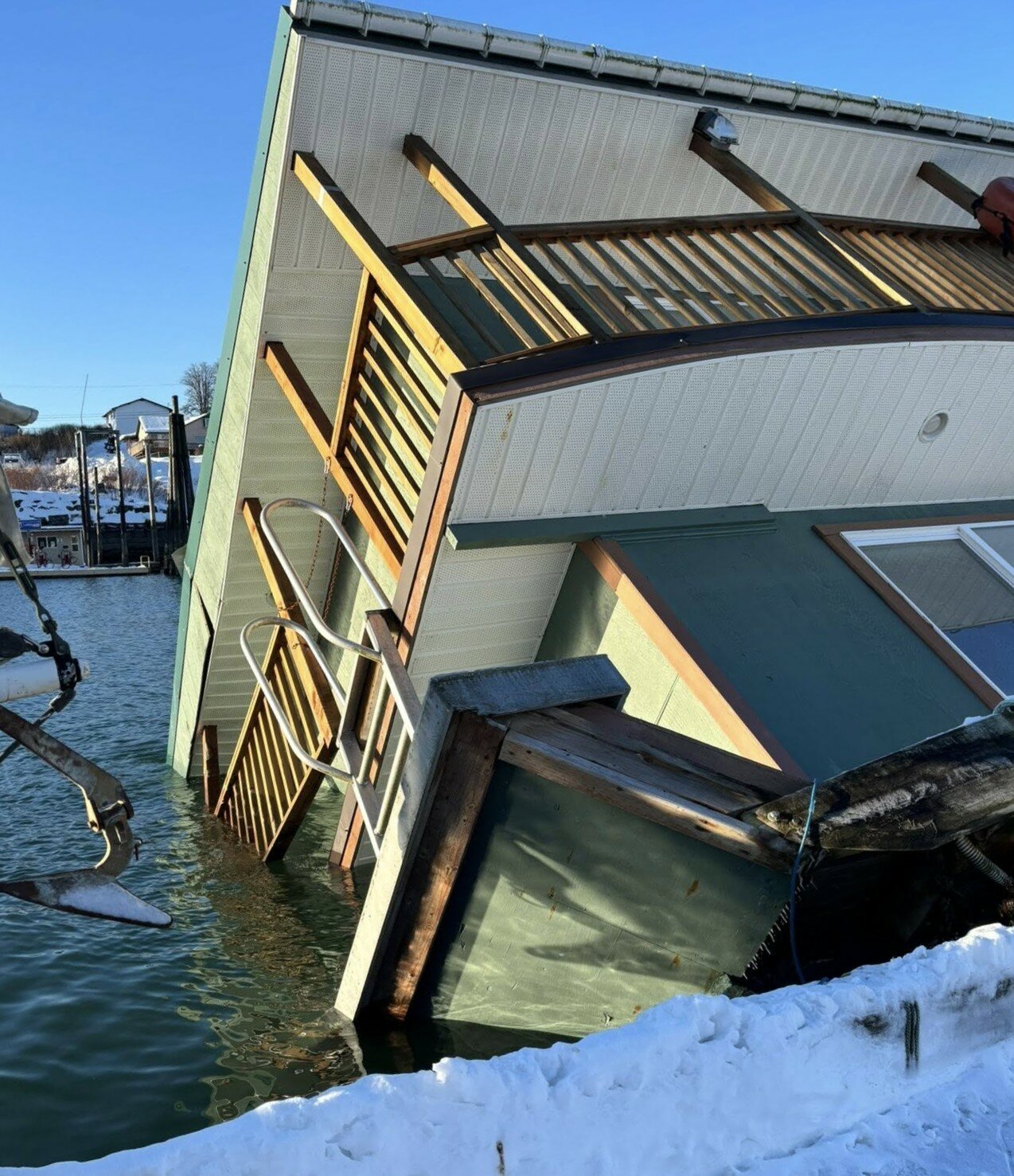 Crews rescue half-sunken camp barge at Reliance dock - Wrangell Sentinel